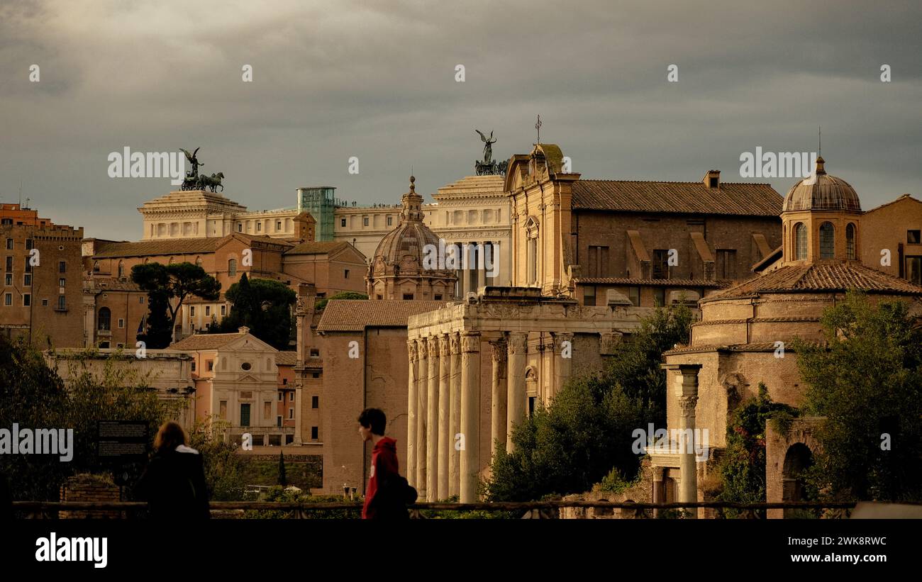 A scenic view of a sunset in Rome with buildings and ruins, Italy Stock ...