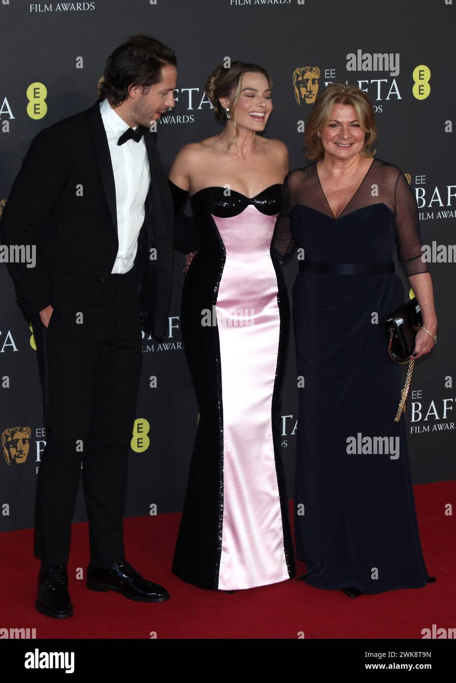 London, UK. Tom Ackerley, Margot Robbie and Josey McNamara at the EE ...