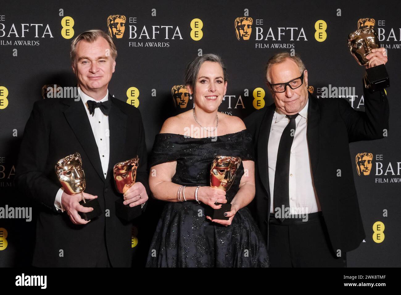Christopher Nolan, Emma Thomas and Charles Roven poses backstage at the ...