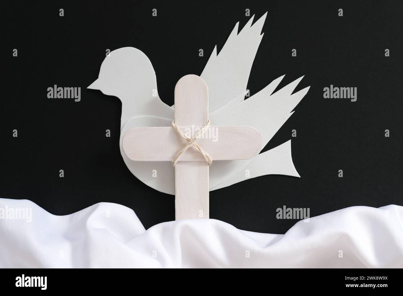 White wooden cross and fabric as symbol of heaven. Funeral and burial ...