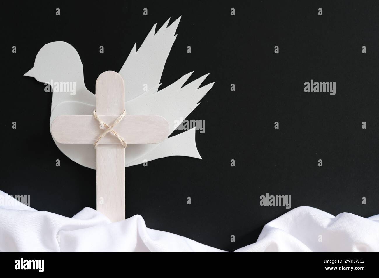 White wooden cross and fabric as symbol of heaven. Funeral and burial ...