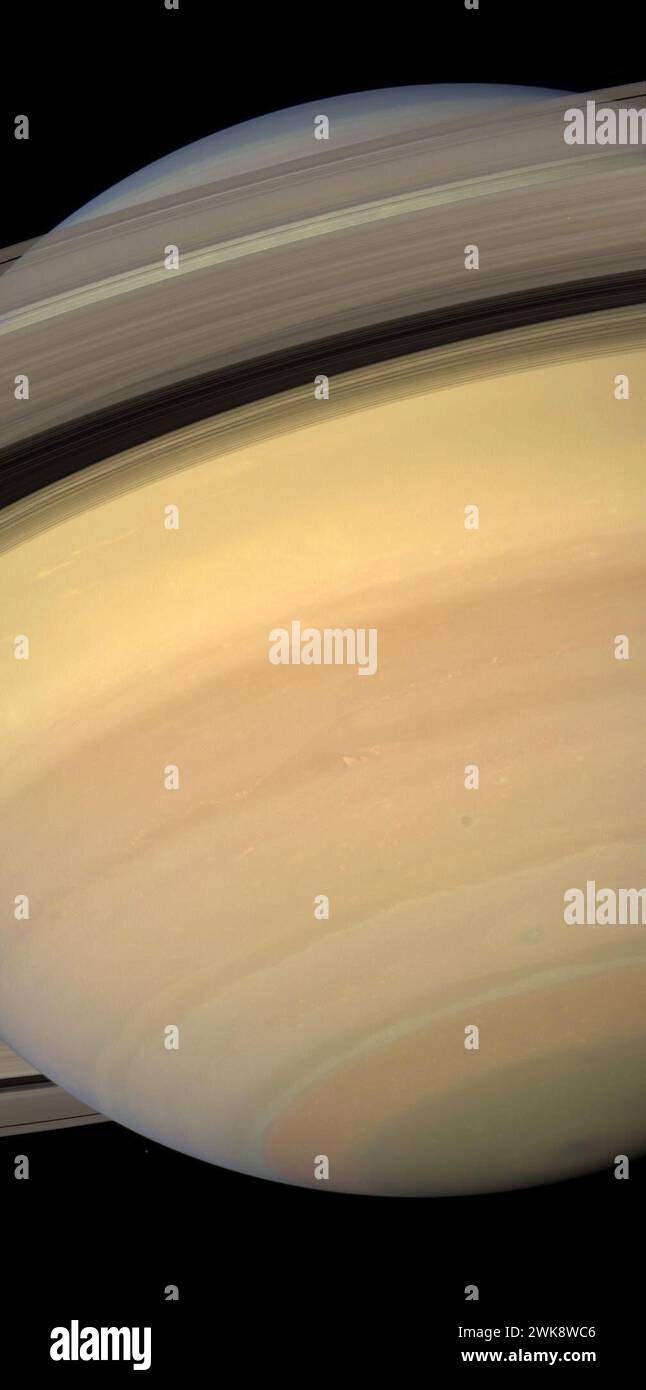 Vertical Photo of Saturn, showing pastel blues, pinks, greens and golds ...