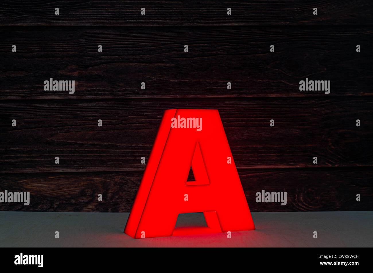 The light letter A is part of an advertising sign. Red color Stock ...