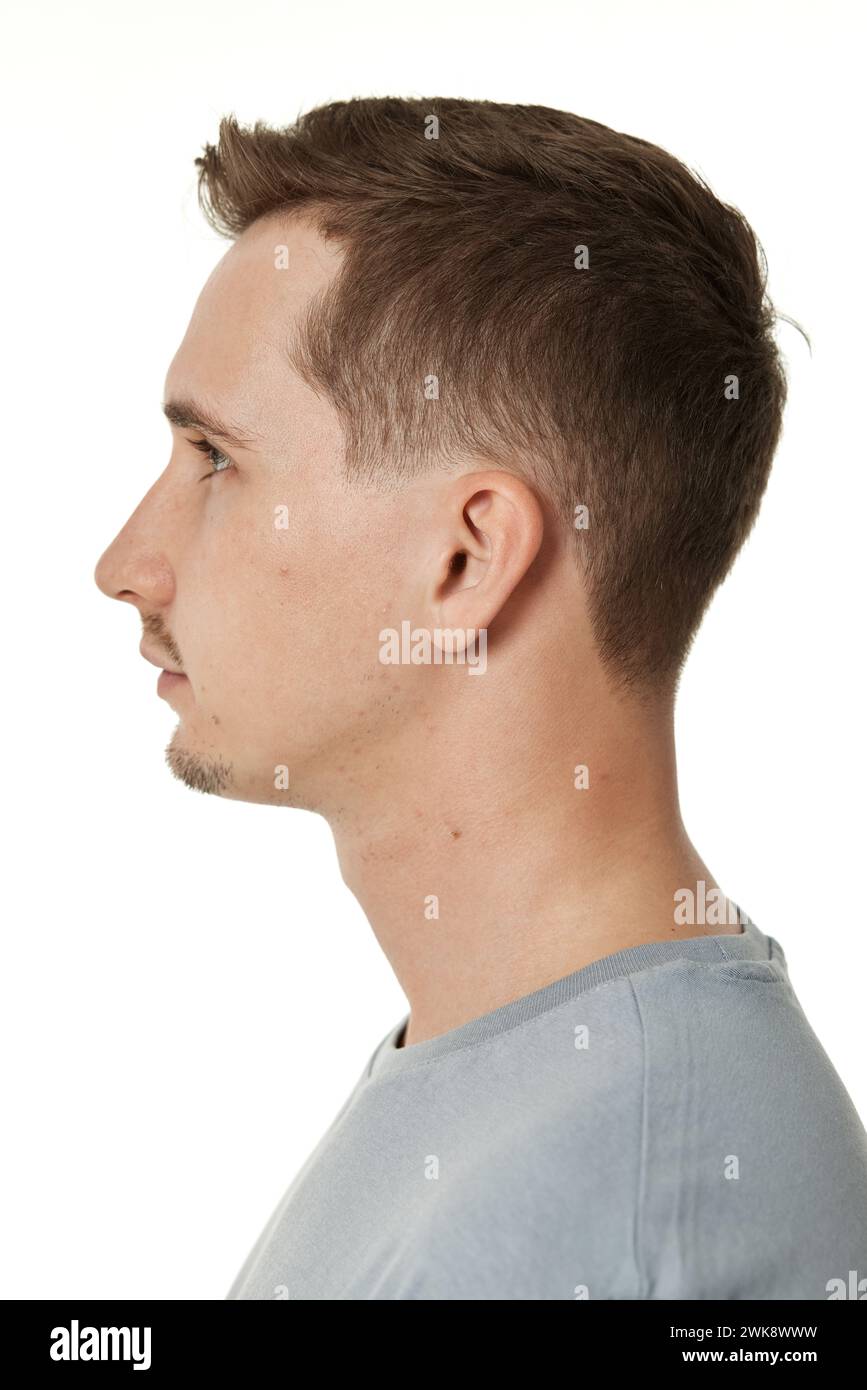handsome young calm man on white background Stock Photo - Alamy