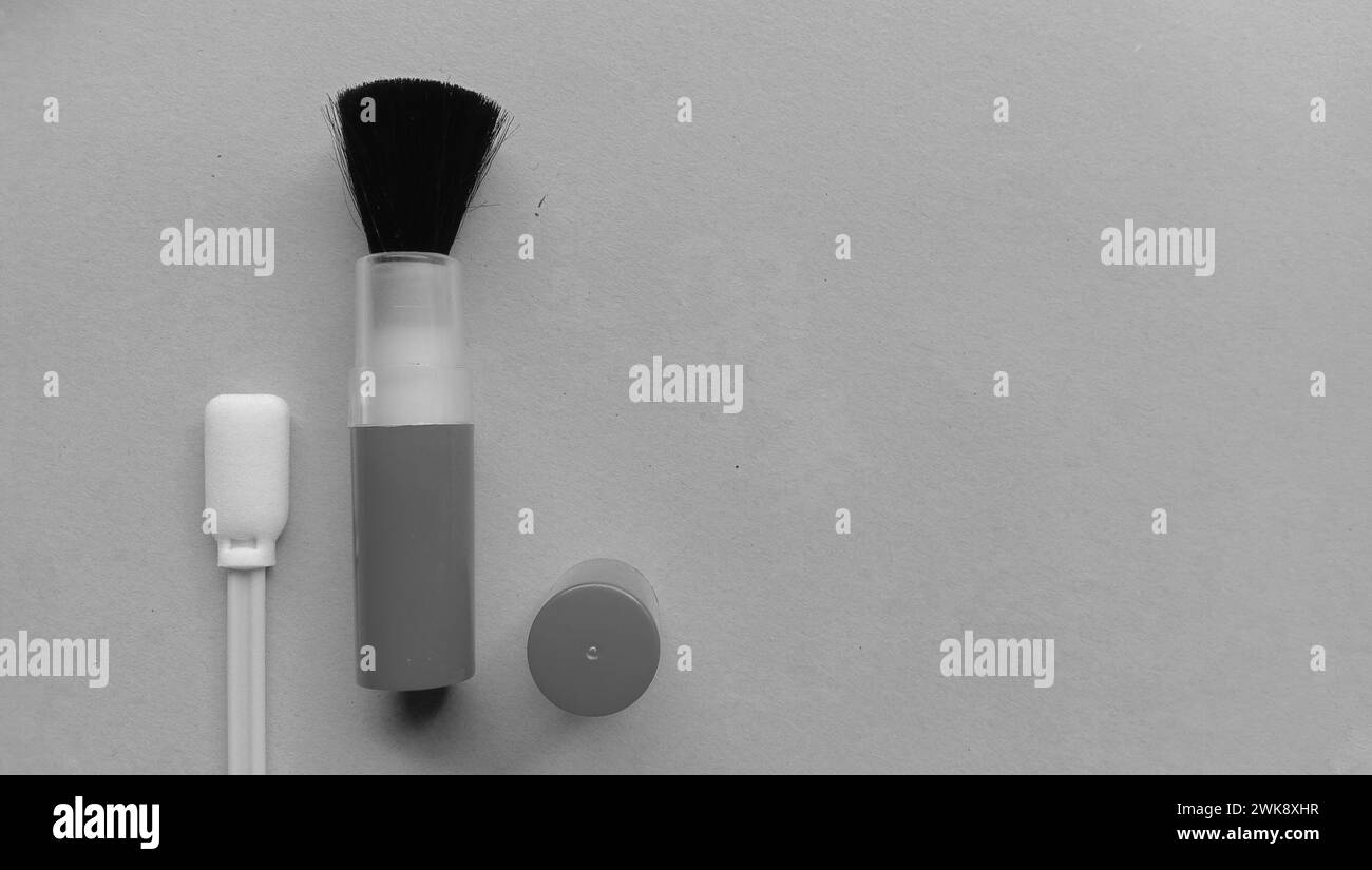 The photo tool for cleaning the camera is a brush and a blue background ...