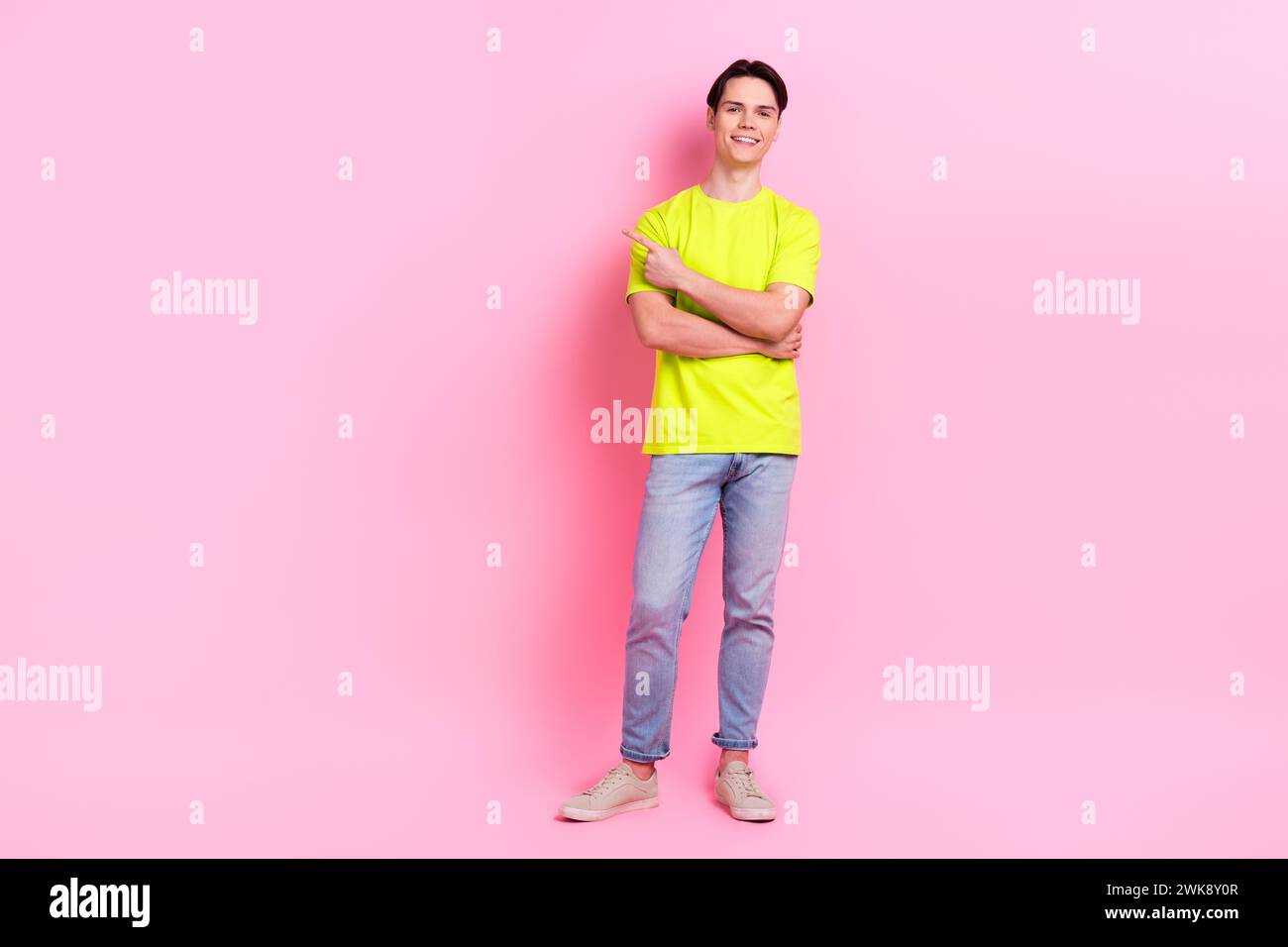 Full length photo of funky cheerful guy wear green t-shirt pointing ...
