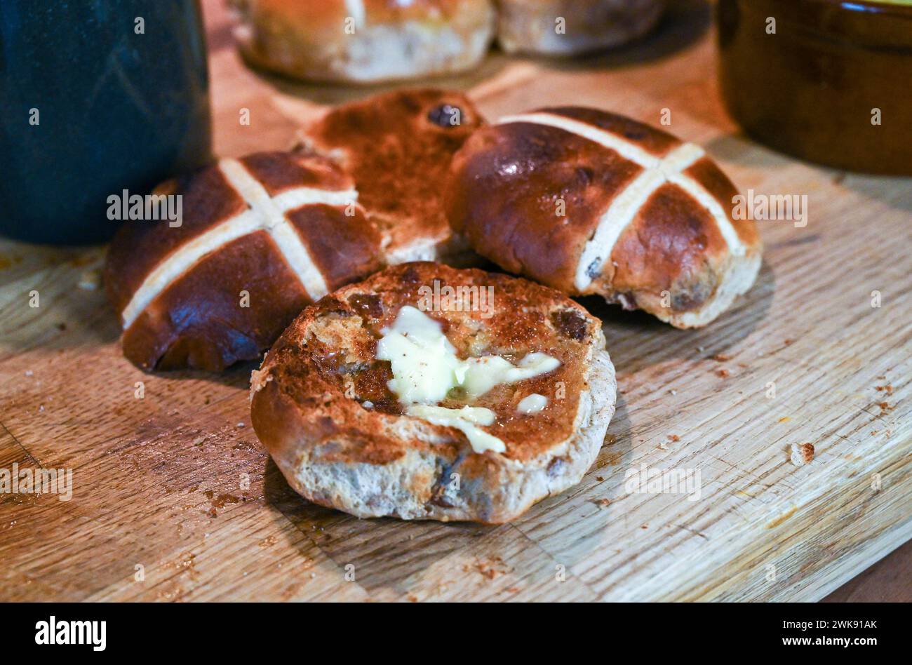 Toasted Hot Cross Buns with butter a traditional breakfast food eaten ...