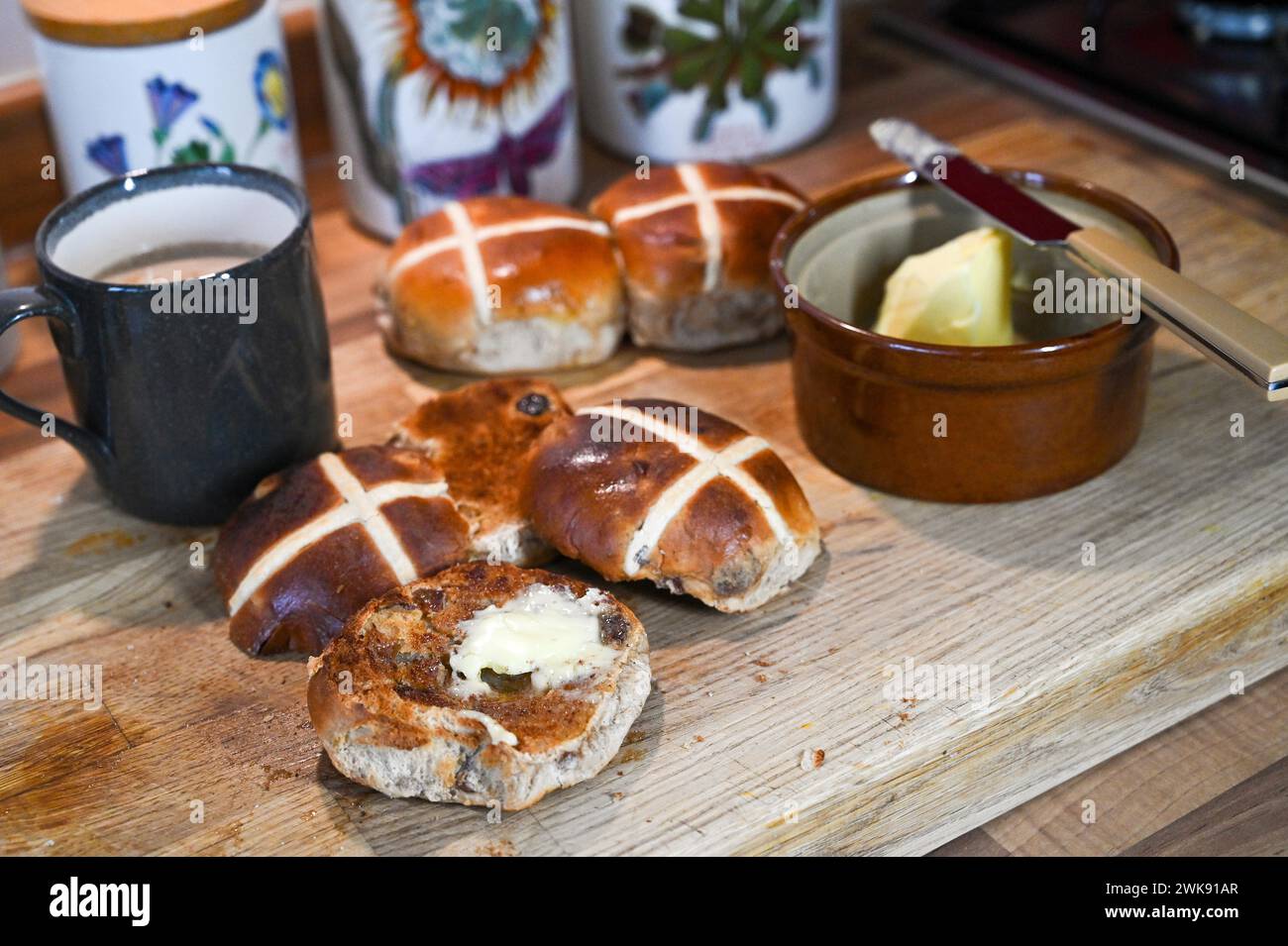 Toasted Hot Cross Buns with butter a traditional breakfast food eaten ...