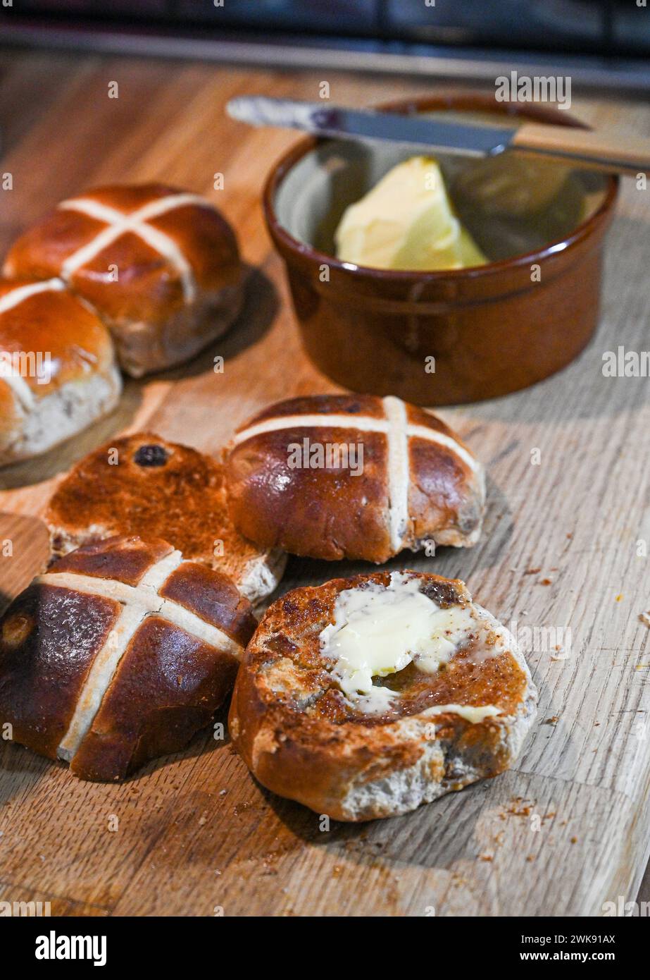 Toasted Hot Cross Buns with butter a traditional breakfast food eaten ...