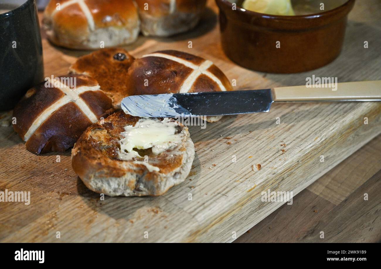 Toasted Hot Cross Buns with butter a traditional breakfast food eaten ...