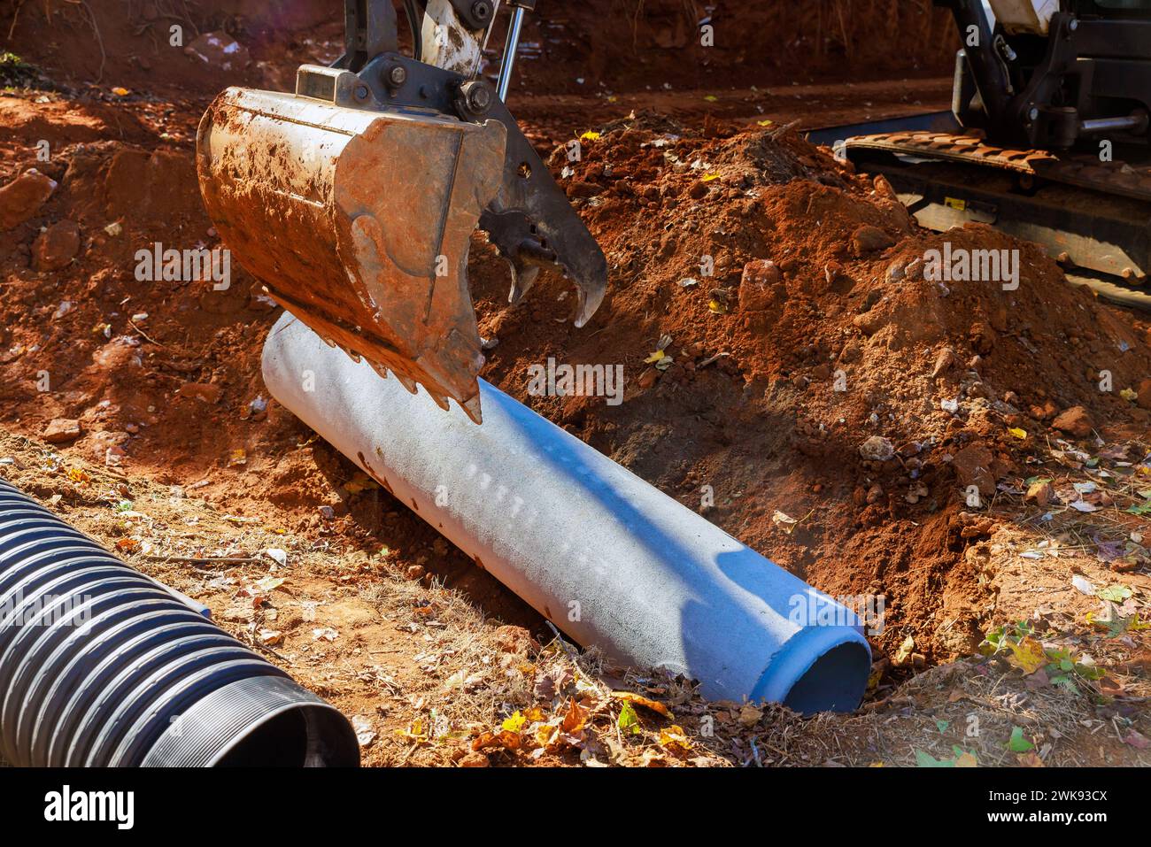Installation of pipes at construction site that allow rainwater to flow ...