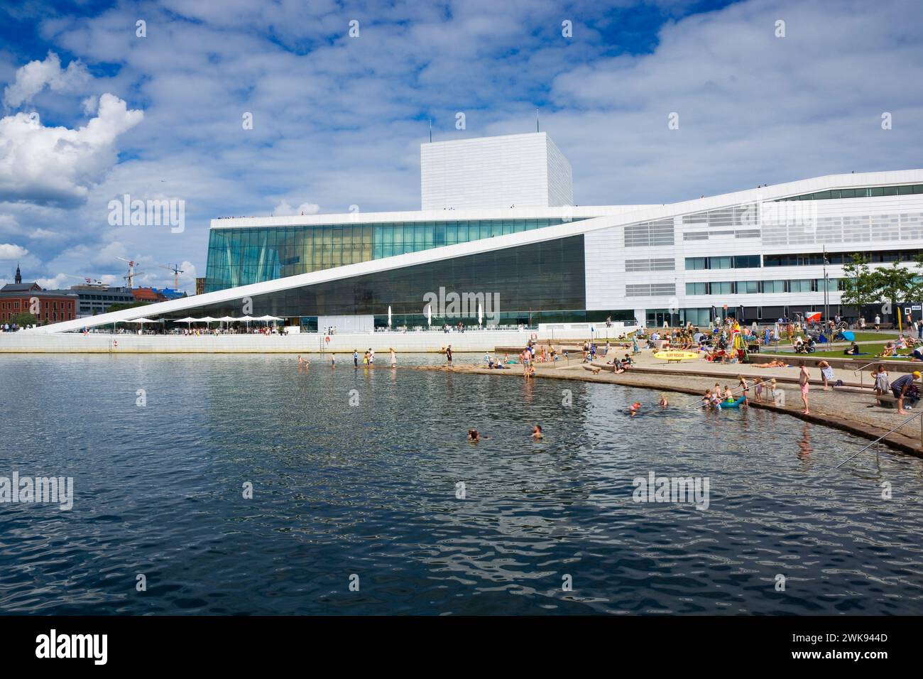 Modern architecture of the National Opera House and city beach in Oslo ...
