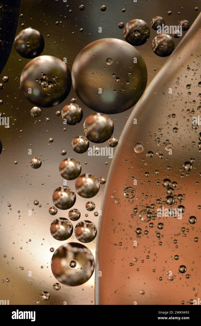 Abstract oil bubbles on water with reflections of colors and patterns ...