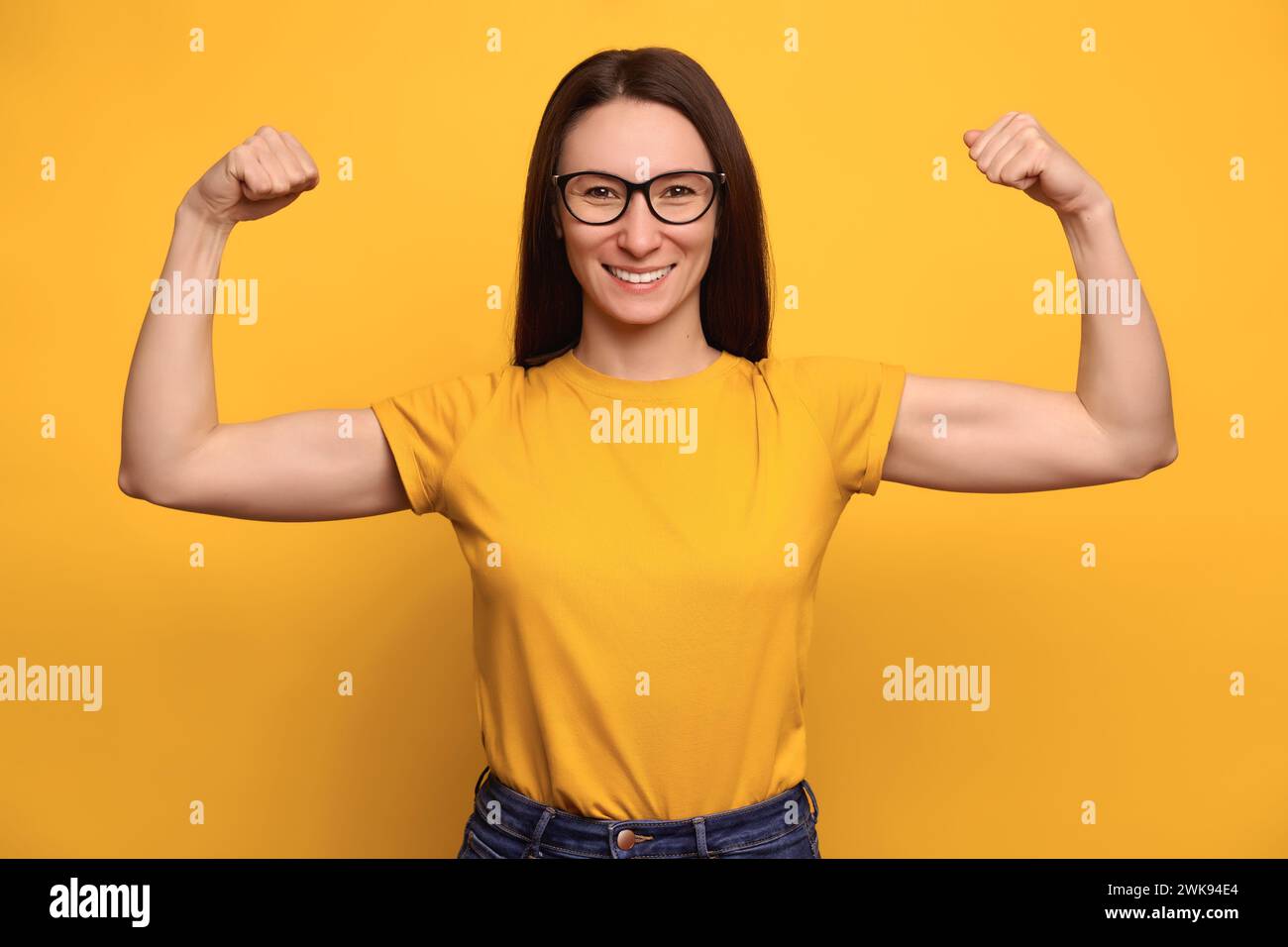 Strong powerful woman with dark hair, eyeglasses and toothy smile ...
