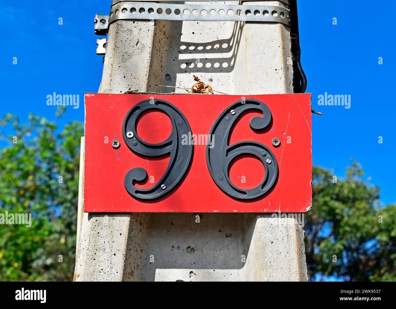 Street sign number 96 on a concrete pole Stock Photo - Alamy