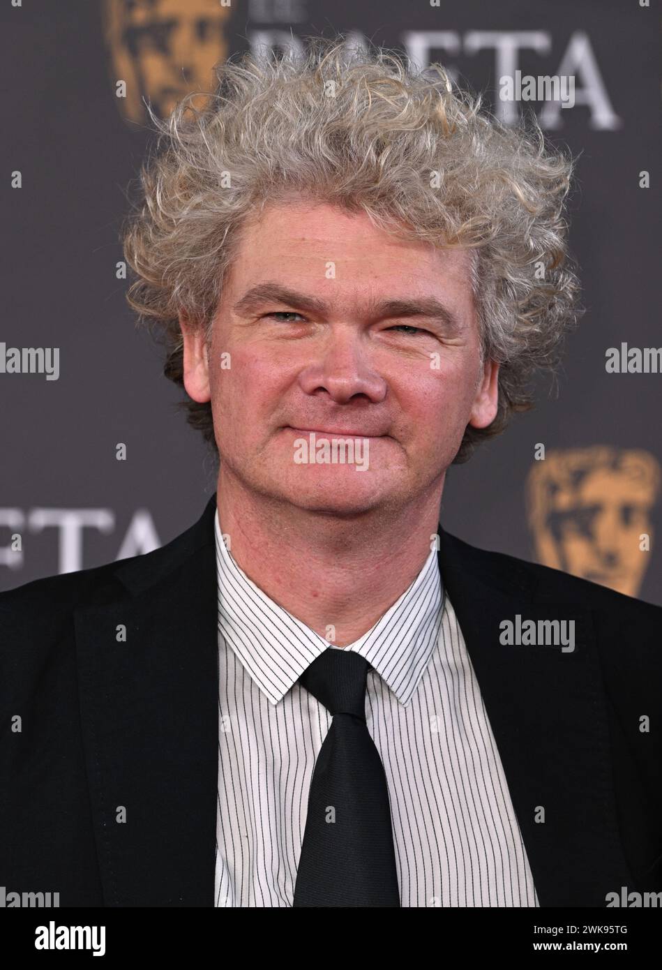 London, UK. February 18th, 2024. Simon Farnaby arriving at the 2024 EE BAFTA Film Awards, Royal ...