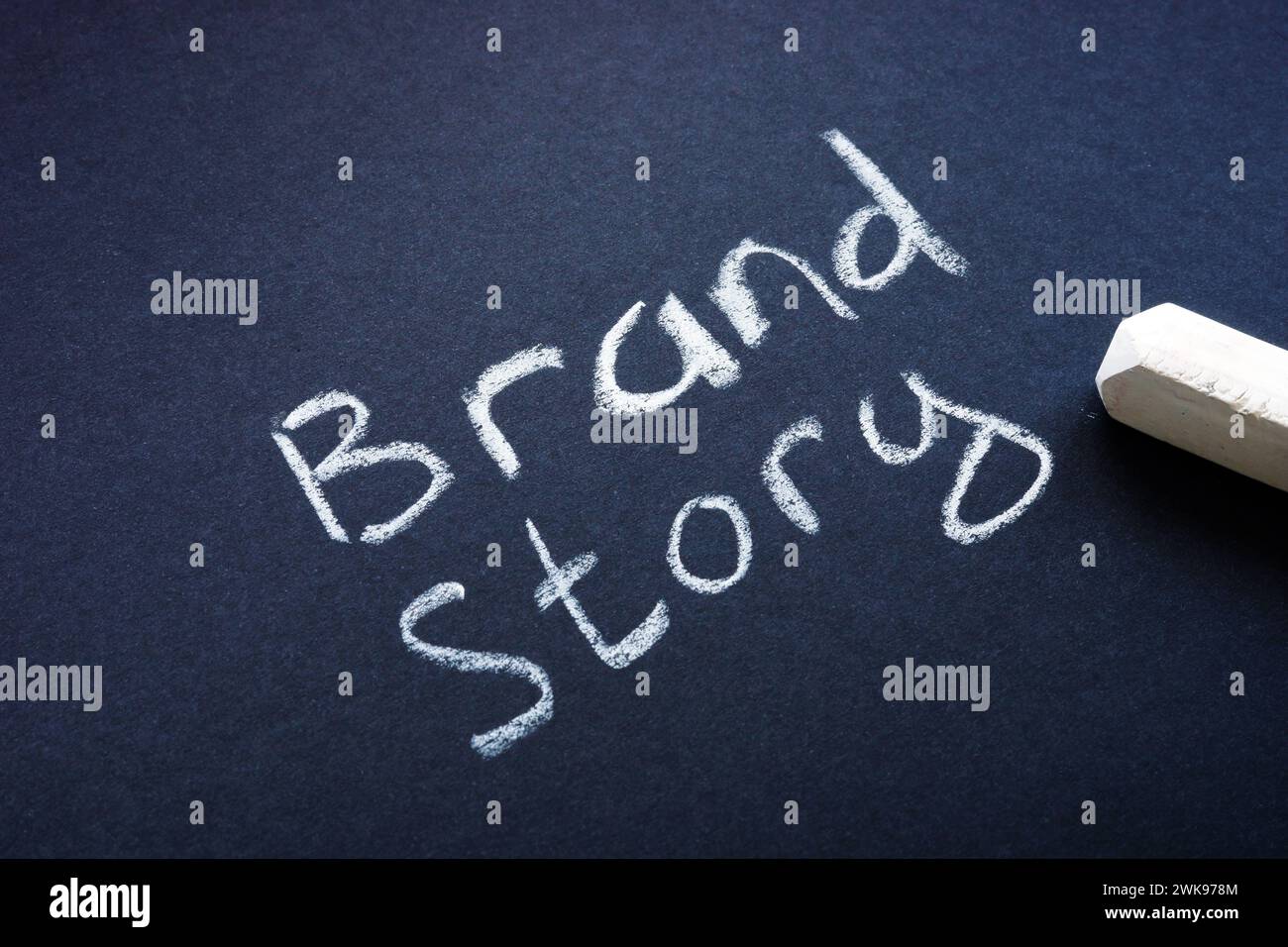 Brand story concept. Handwritten inscription with chalk Stock Photo - Alamy
