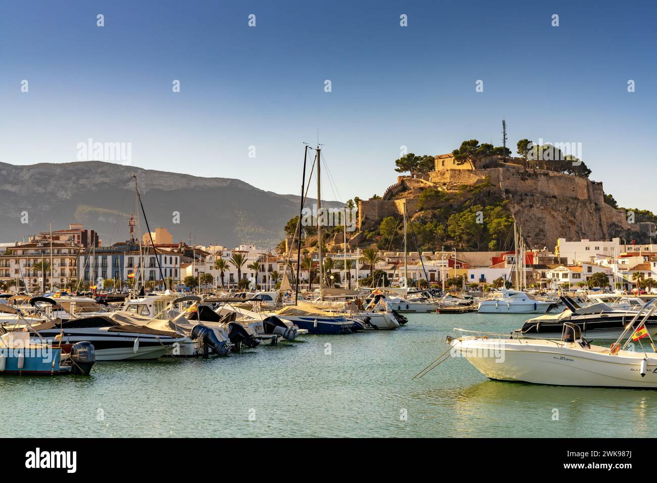 Denia, Spain - 7 February, 2024: view of the sports marina and harbour and historic hilltop ...