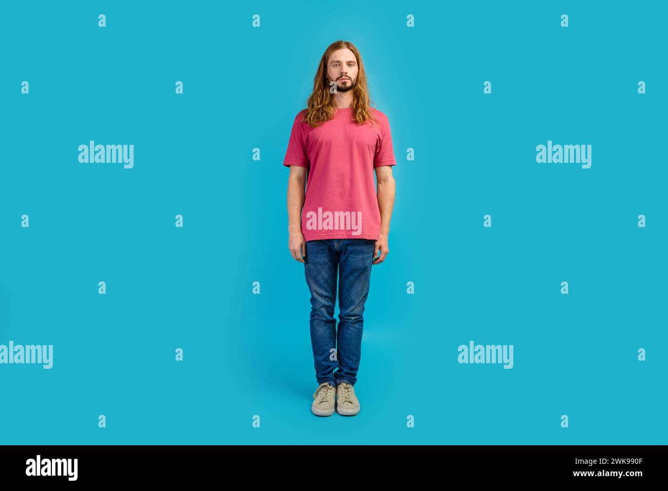 Full size photo of calm focused concentrated young man standing posing ...