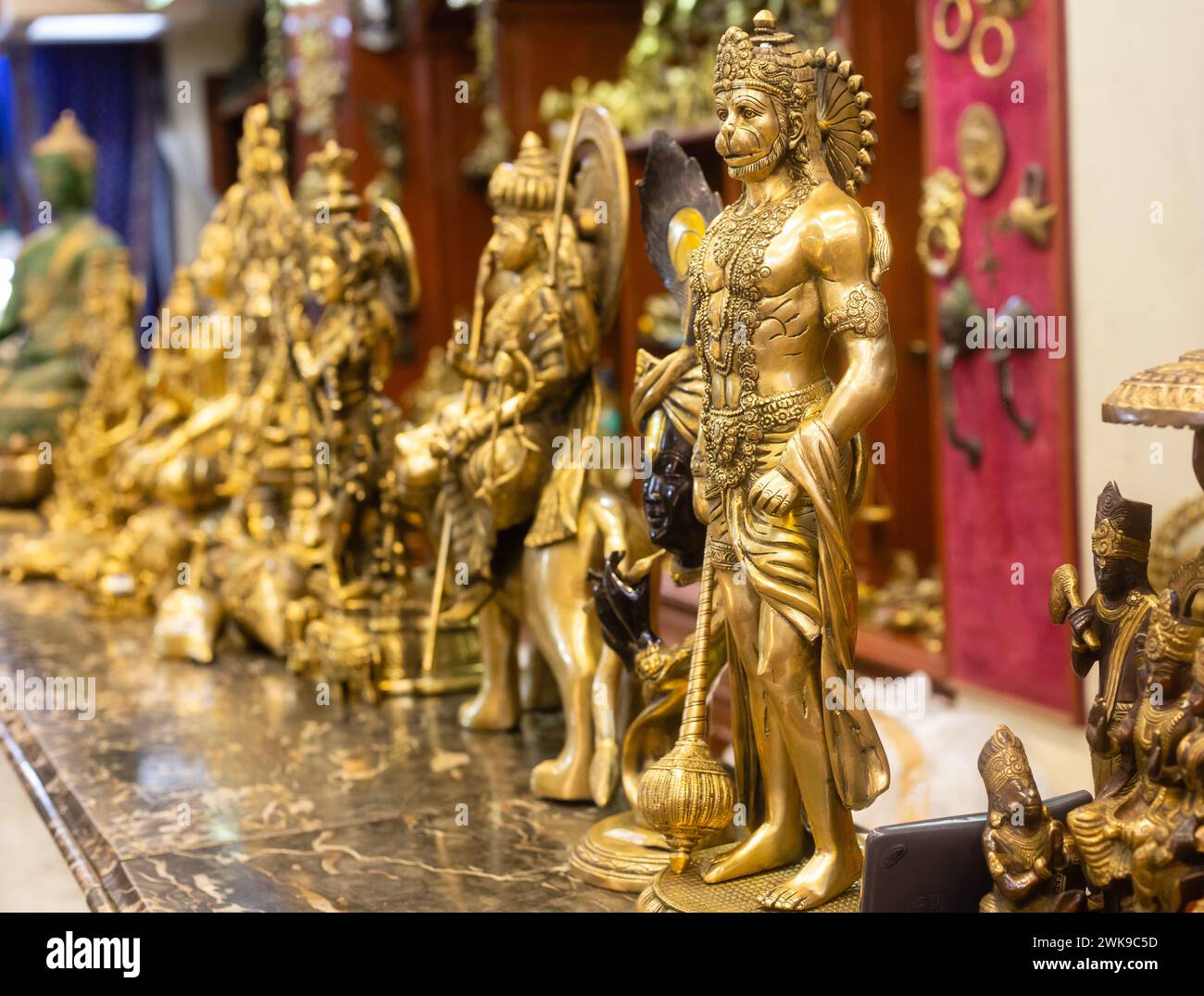 Brass idol of lord Hanuman along with other statues being sold at an ...