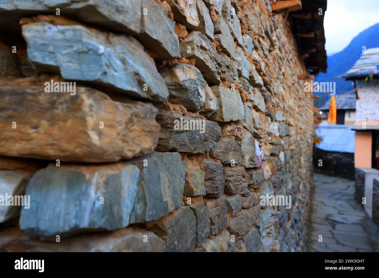 house of traditional rock wall in a Gurung village in Ghandruk town ...