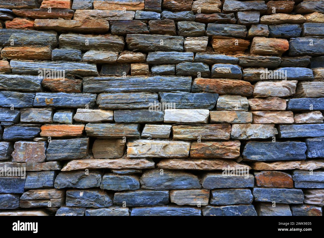 house of traditional rock wall in a Gurung village in Ghandruk town ...