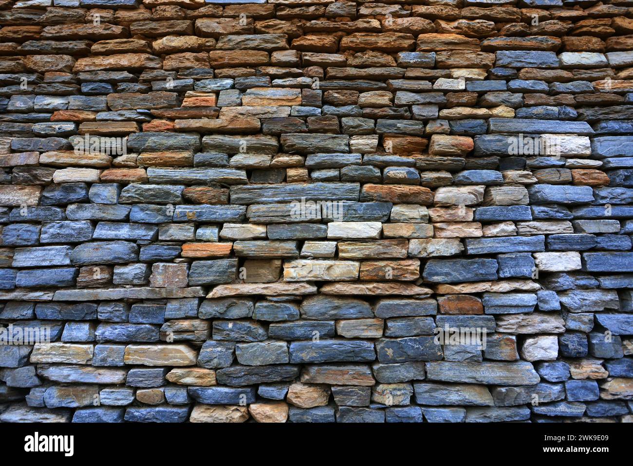 house of traditional rock wall in a Gurung village in Ghandruk town ...
