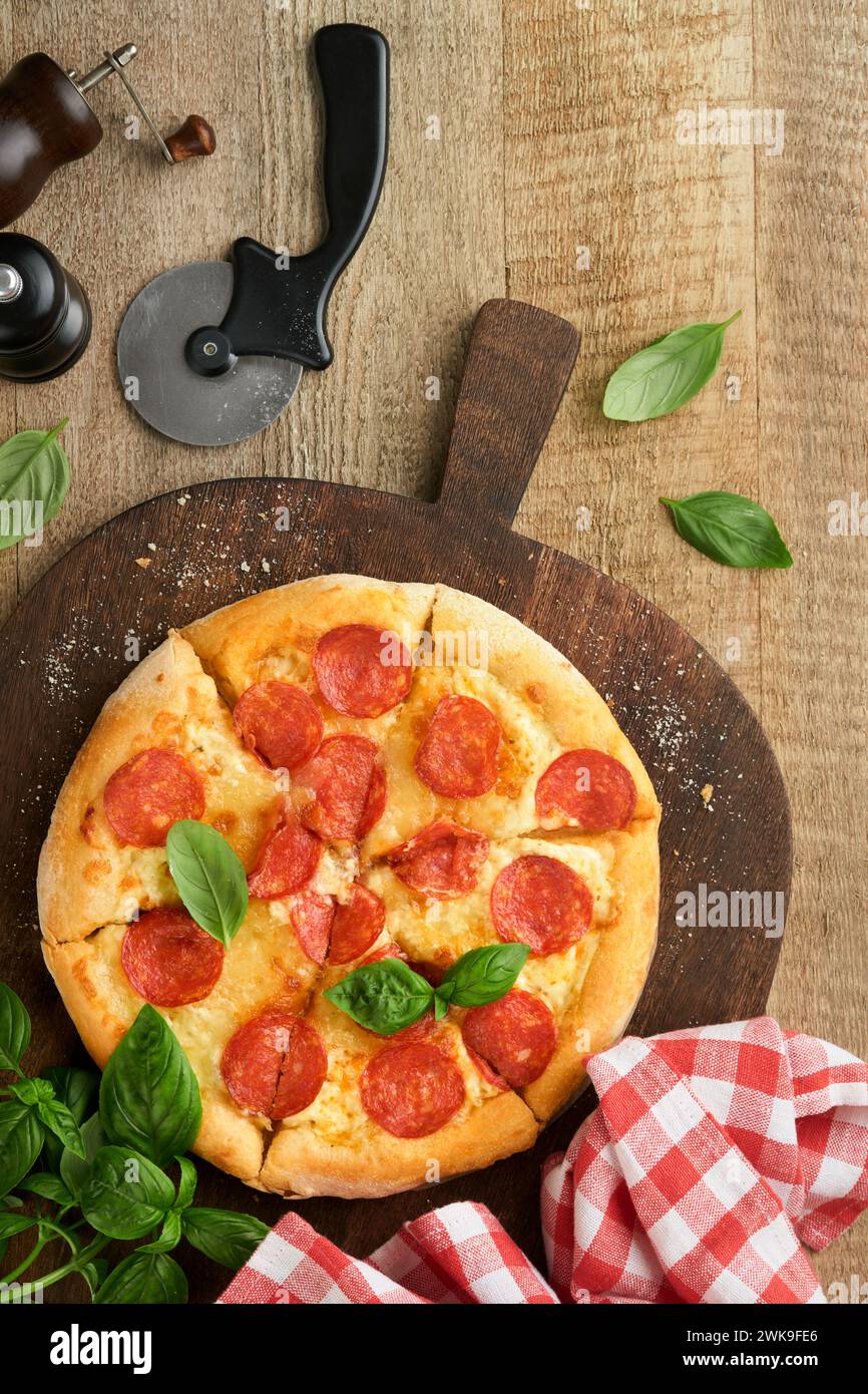 Pepperoni pizza. Traditional pepperoni pizza and cooking ingredients ...