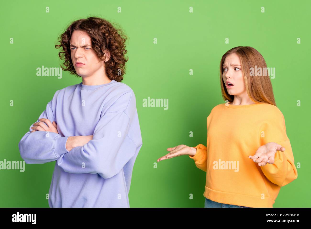 Portrait of questioned girl shrug shoulders mad offended guy folded ...