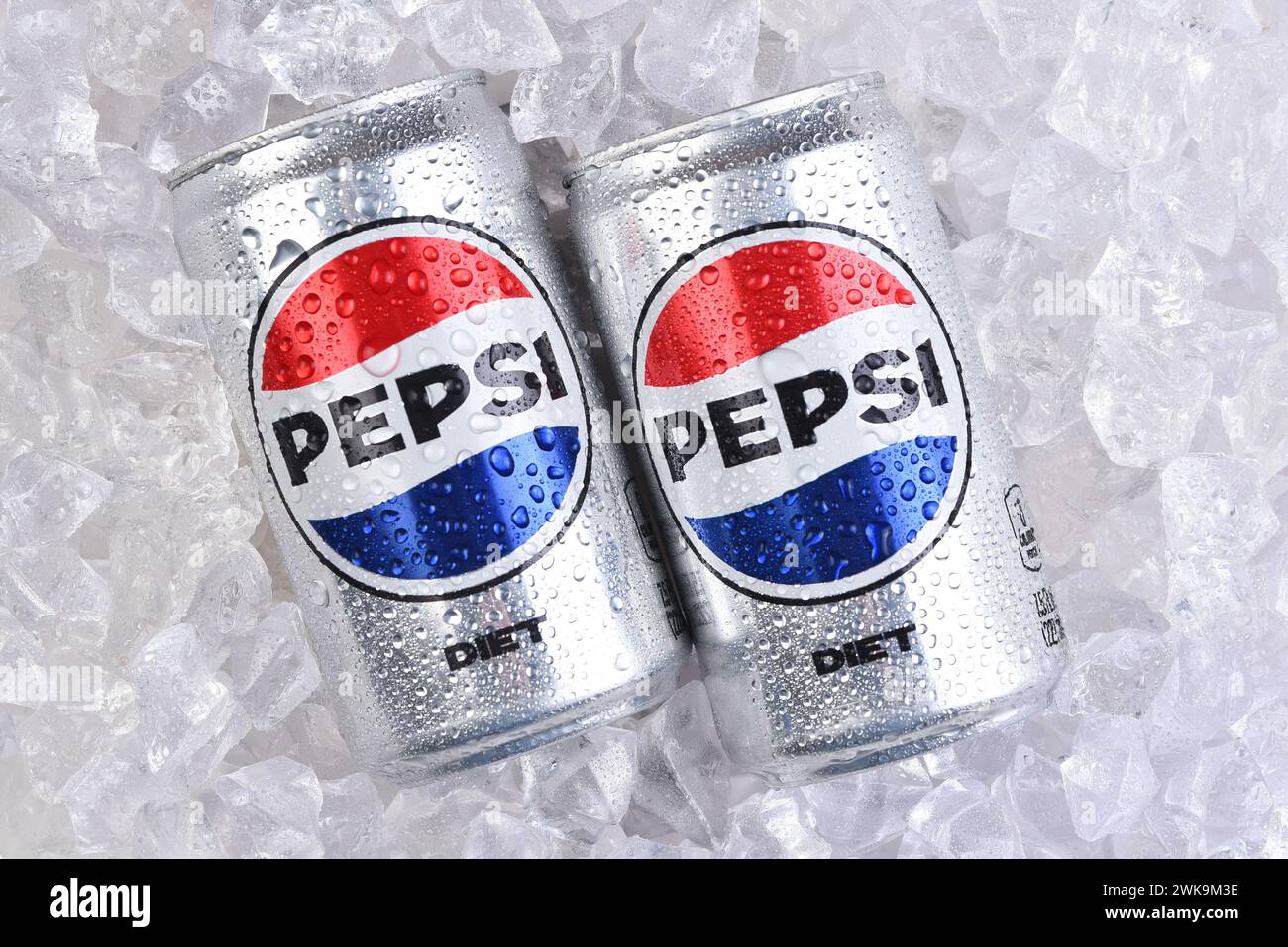 IRVINE, CALIFORNIA - 18 FEB 2024: Two mini cans of Diet Pepsi on a bed ...