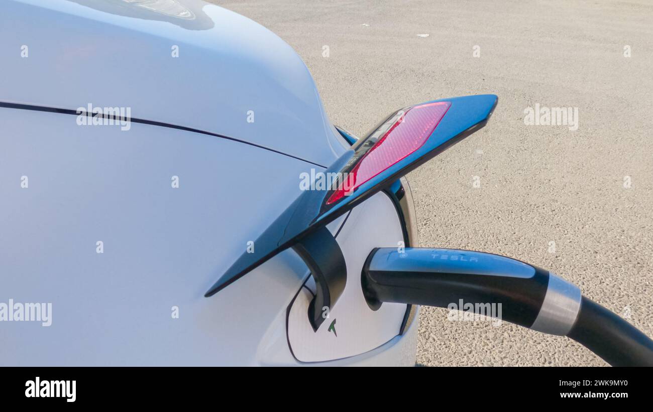 Daytime Tesla Charging, Supercharging Station Power-Up Stock Photo - Alamy
