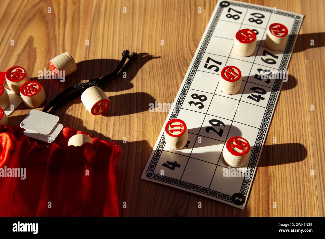 Traditional Bingo Cards and Counters on Wooden Table in Sunlight Stock ...