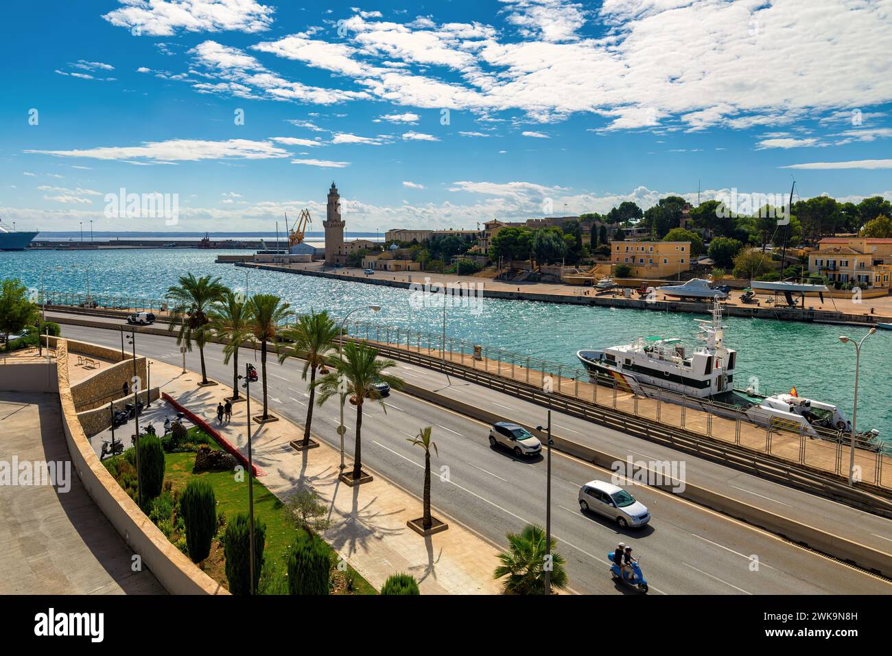 View of the urban road and harbor with lighthouse under beautiful blue ...