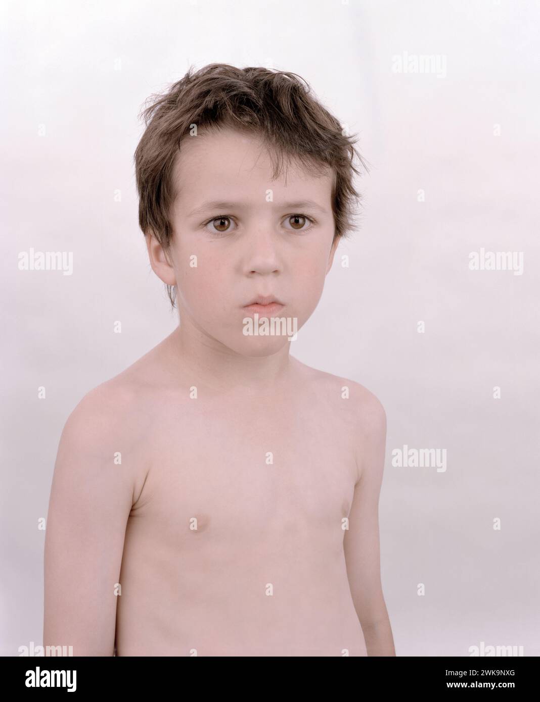 Young white boy, looking across frame, in Studio, studio lighting Stock ...