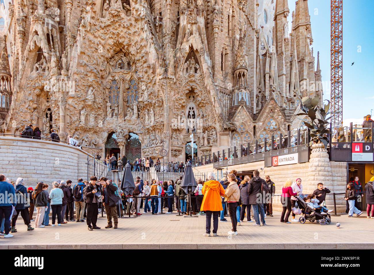 Barcelona, tourists queuing at Sagrada Familia entrance. Tourists ...