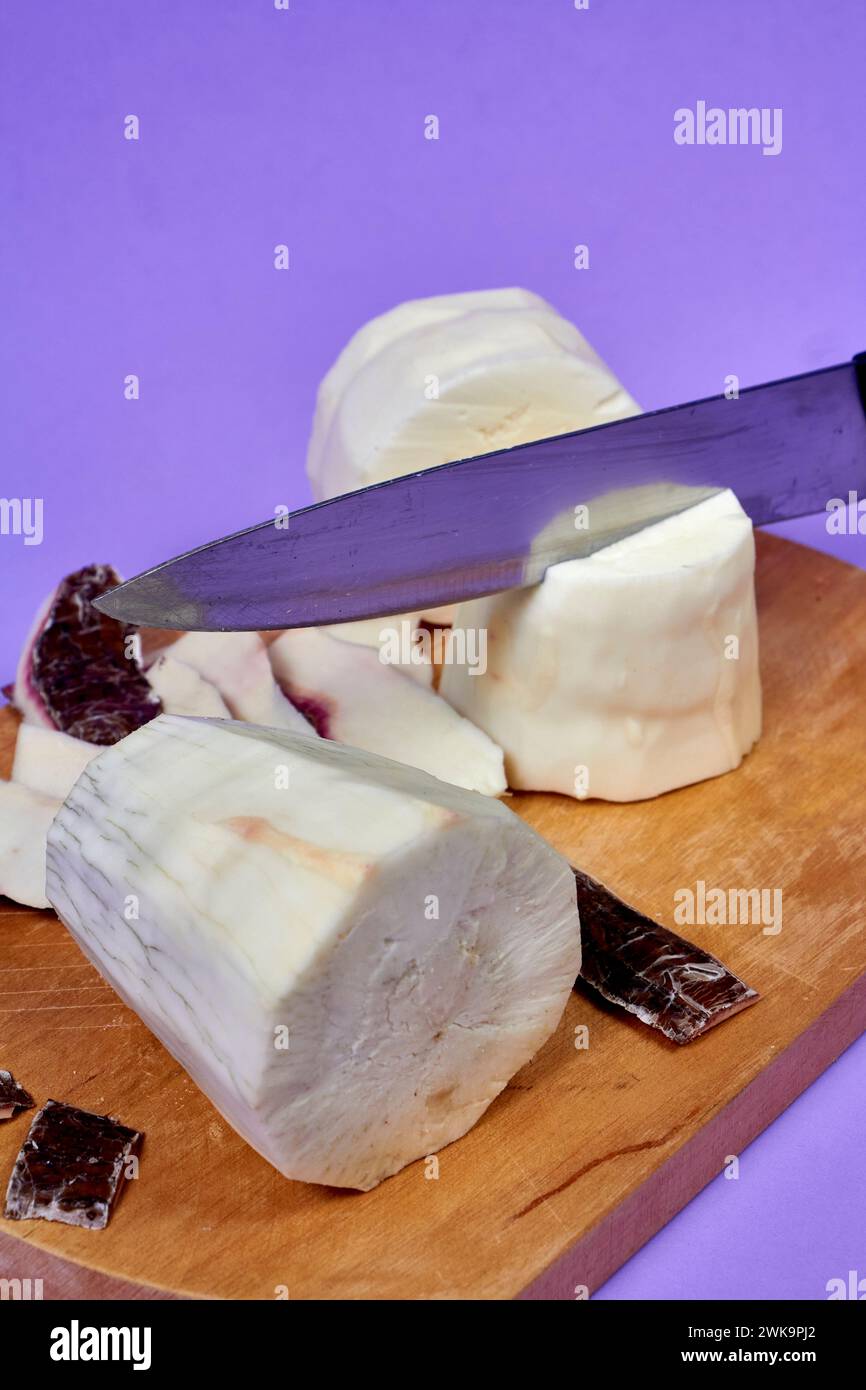 Fresh Organic Cassava Root, Manioc Esculenta, yuca On purple Background ...