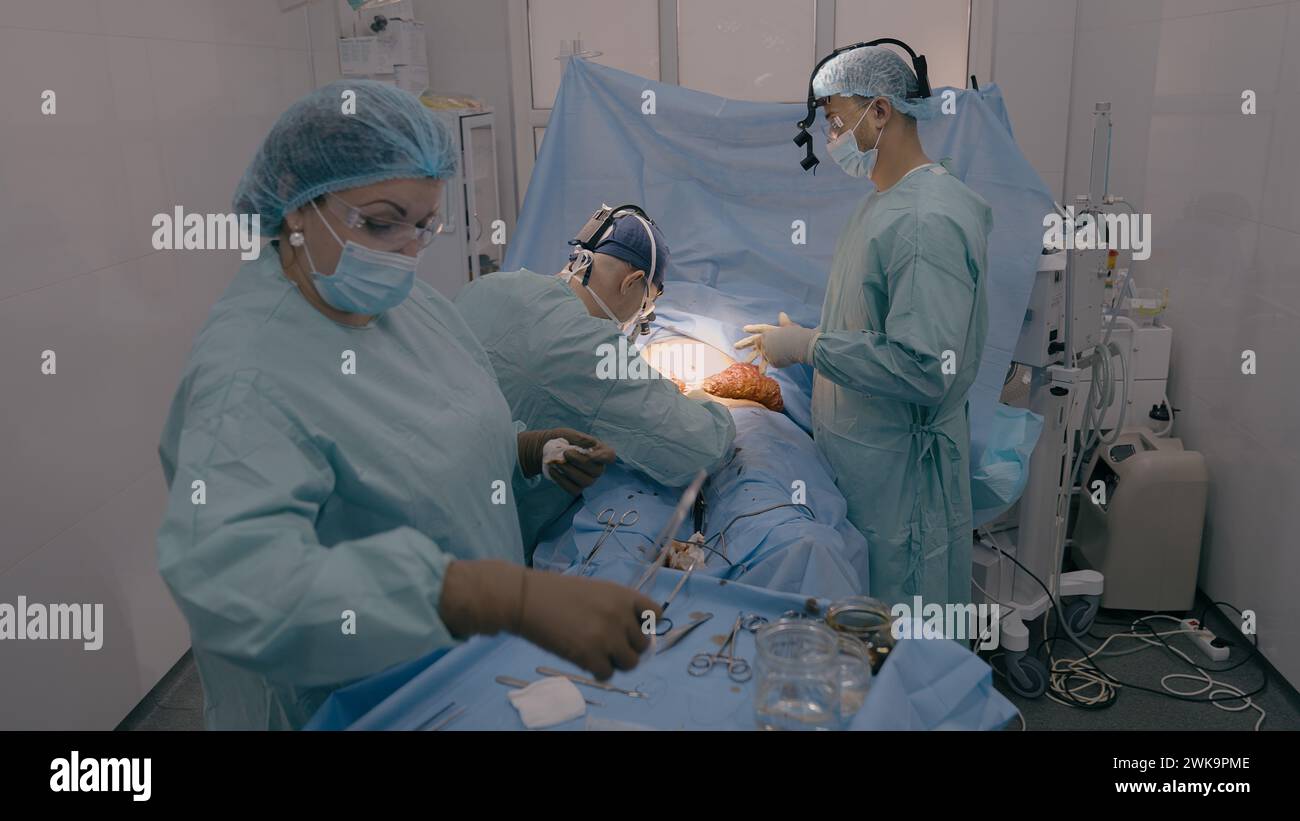 Surgery team professional doctors surgeons perform surgical operation ...