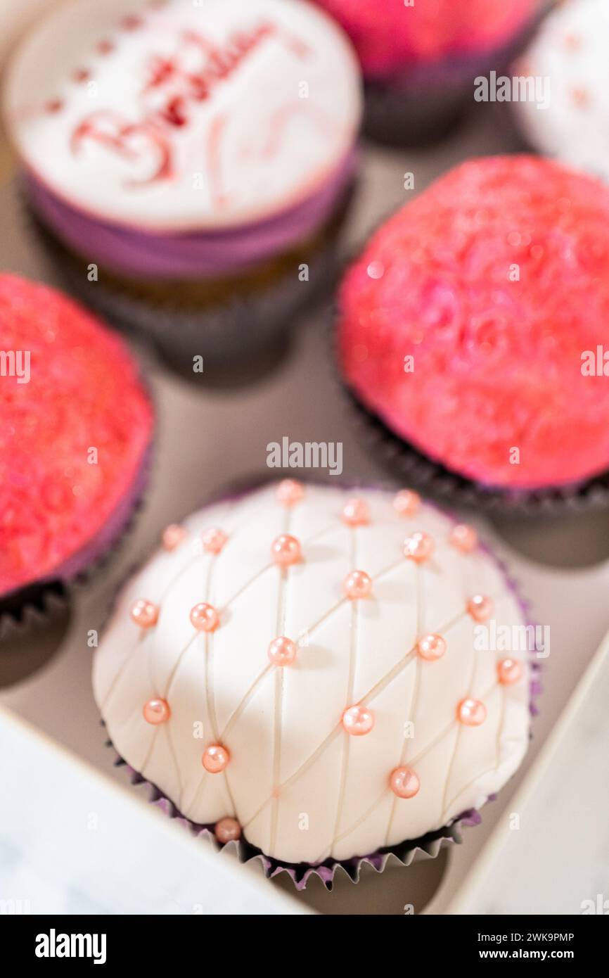 Creating Extravagant Cupcakes for Birthday Celebration Stock Photo - Alamy