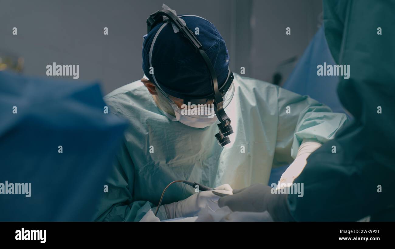 Team surgeons perform operation in operating room professional doctor ...