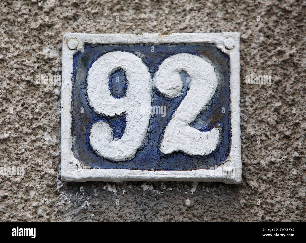 Vintage square ceramic street number plate with number. Close up, brand ...