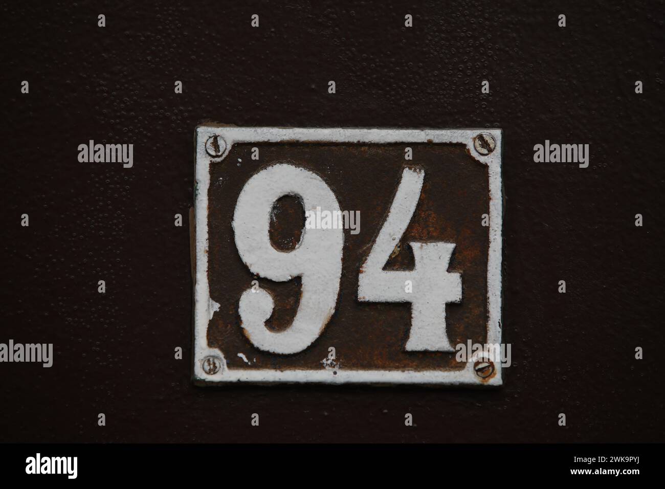 Vintage square ceramic street number plate with number. Close up, brand ...