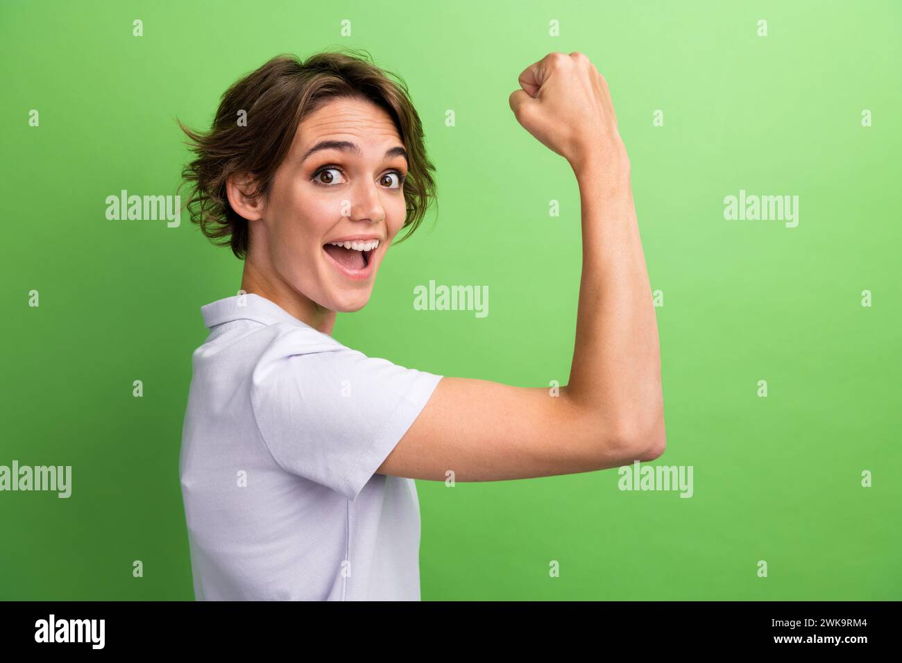 Closeup side photo of young lady show her perfect figure biceps fist up ...