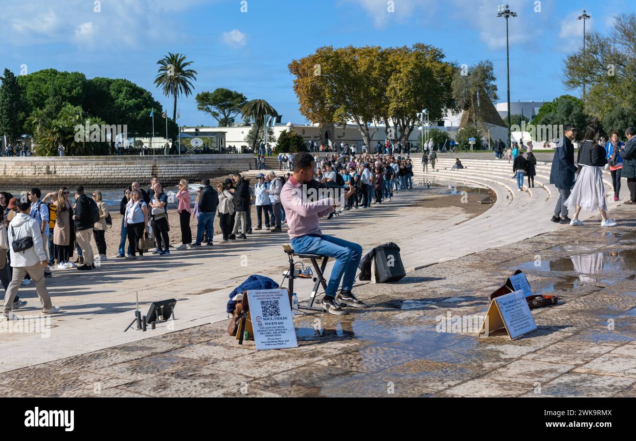 Street musician at the front of Belem Tower Torre de Belem, Lisbon ...