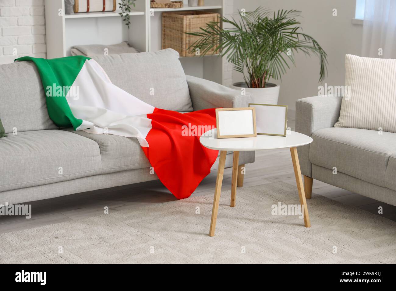 Interior of stylish living room with Italian flag Stock Photo - Alamy
