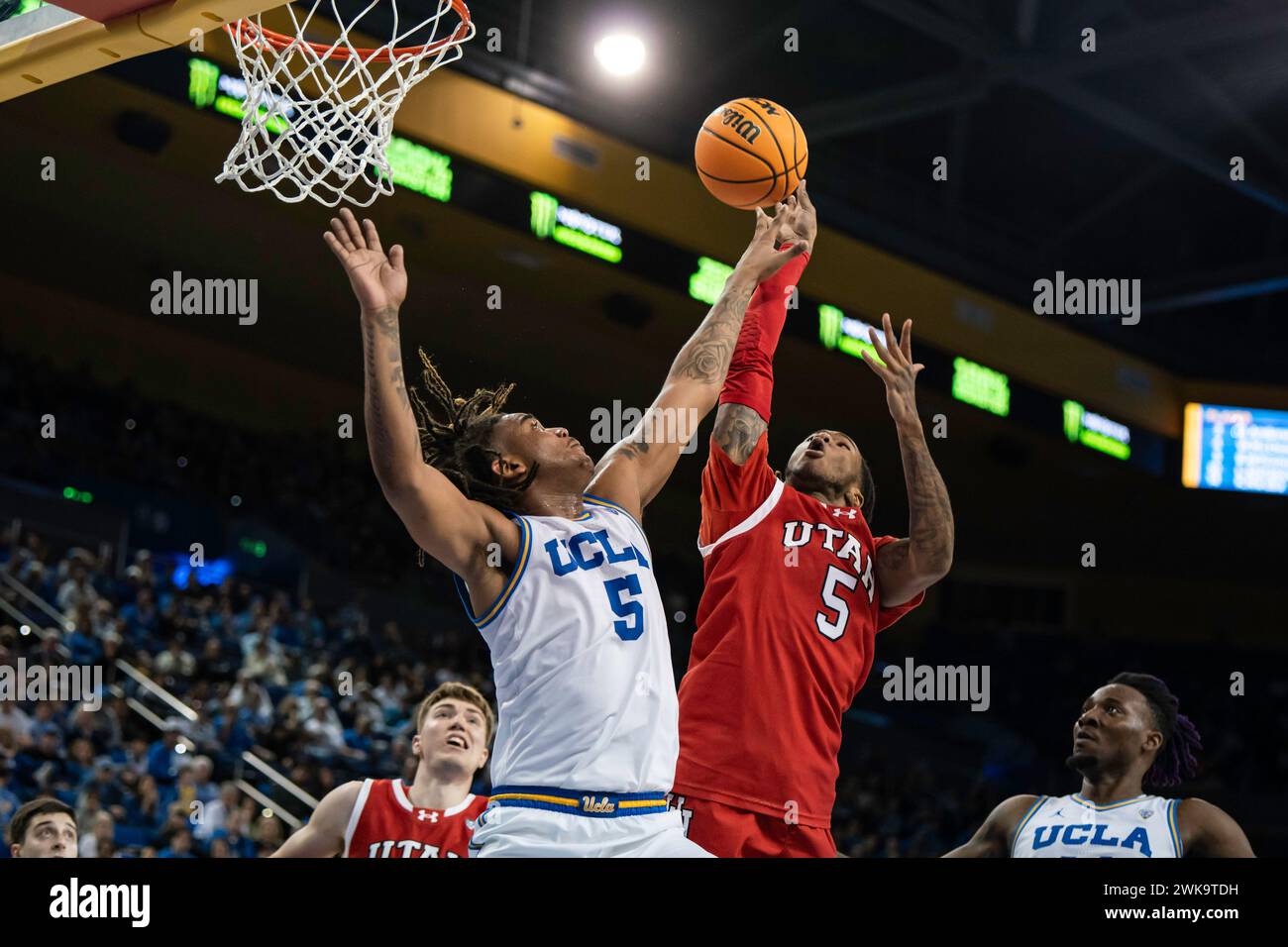 UCLA Bruins guard Brandon Williams (5) fouls Utah Utes guard Deivon ...