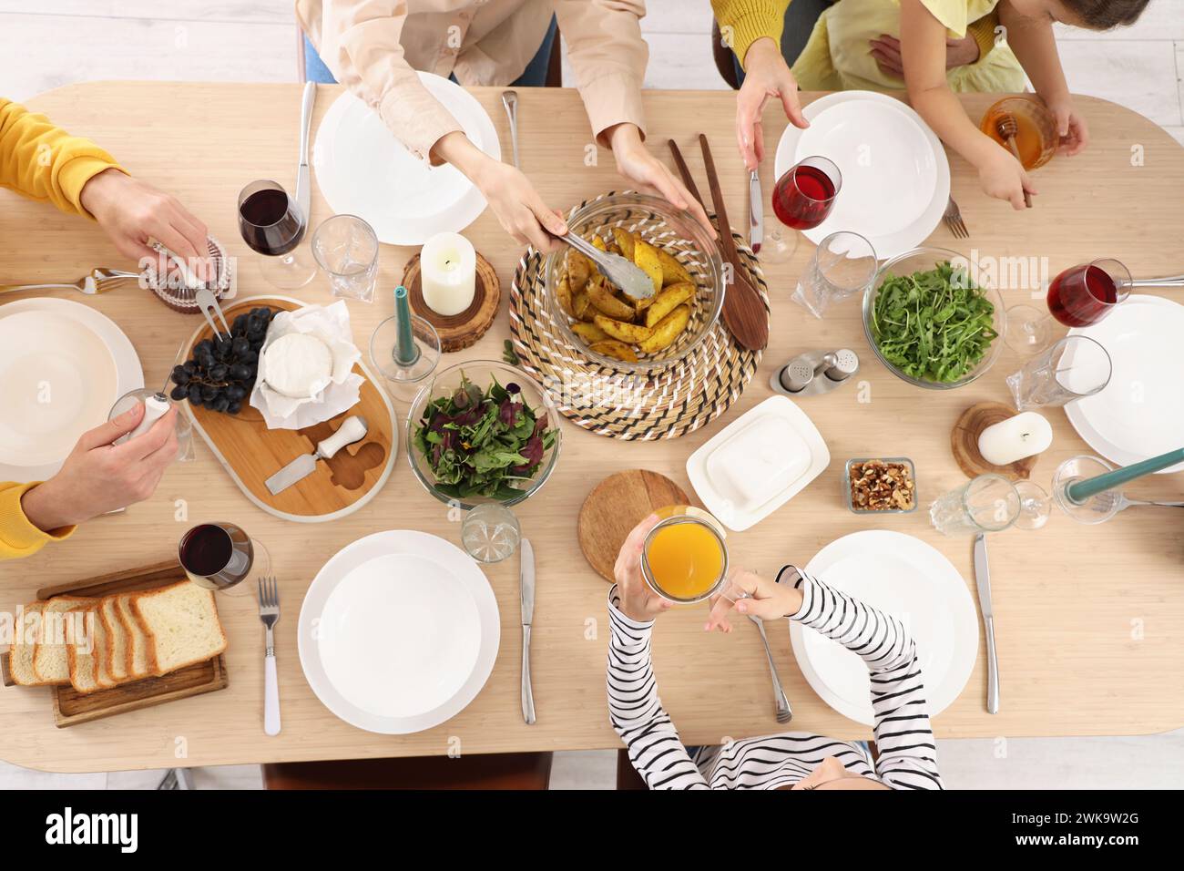 Big family having dinner at table in kitchen, top view Stock Photo - Alamy