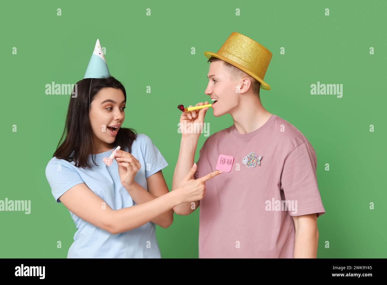 Young friends in funny disguise with party whistles and stickers on ...