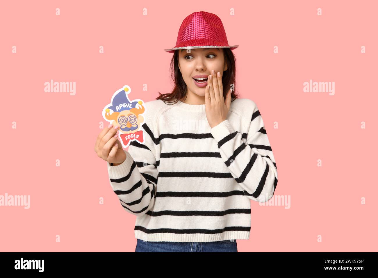 Beautiful young shocked woman in funny disguise with paper clown on ...