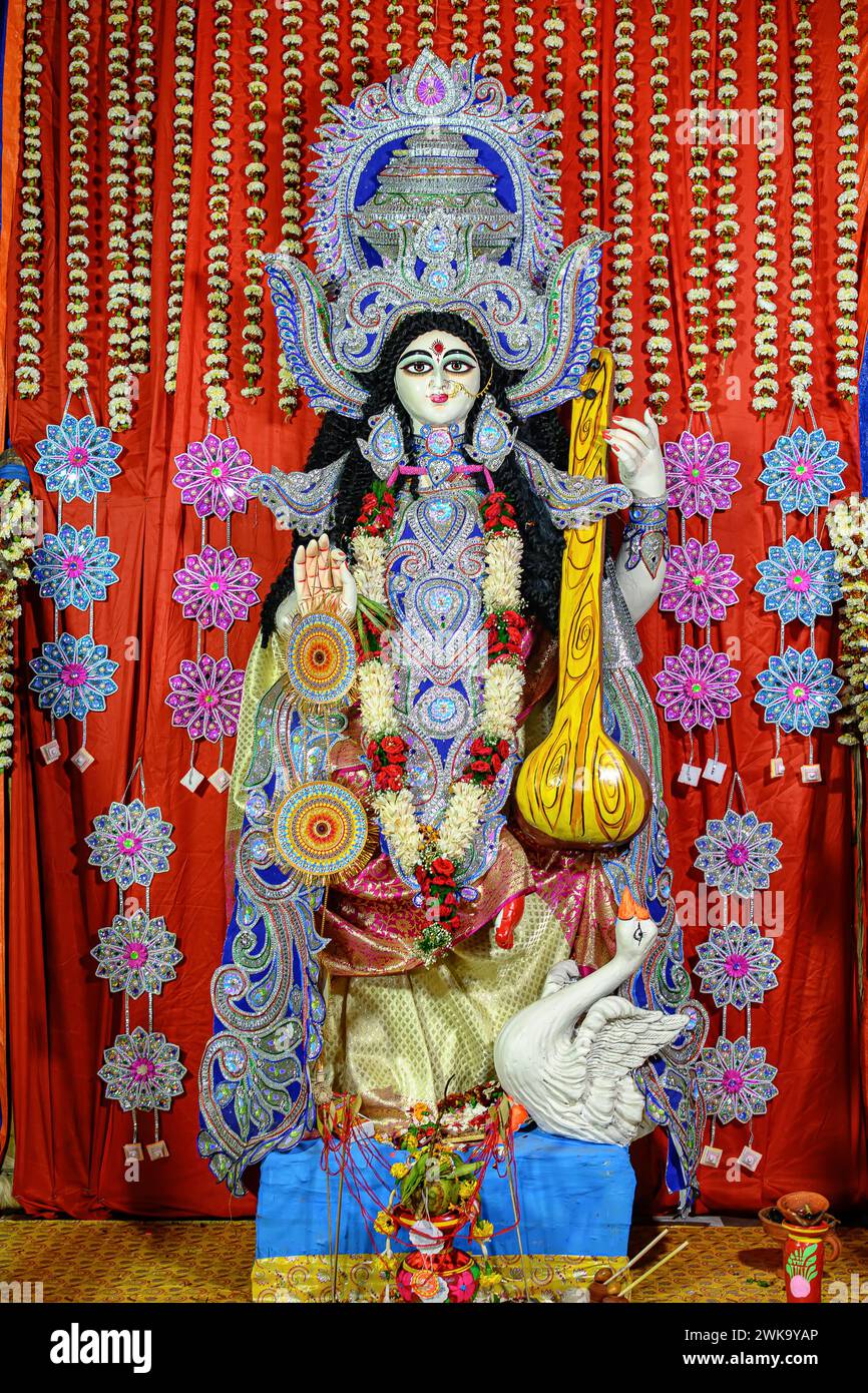 Idol of Goddess Devi Saraswati at a decorated puja pandal in Kolkata ...
