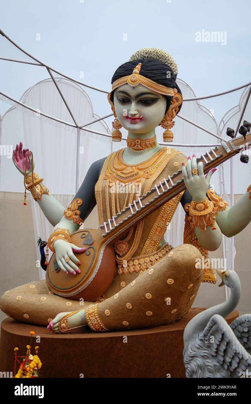 Idol of Goddess Devi Saraswati at a decorated puja pandal in Kolkata ...